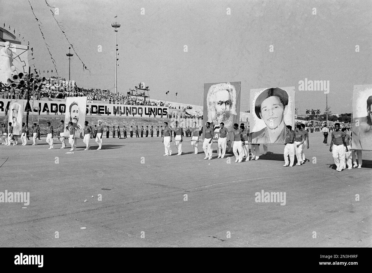 Huge portraits of Fidel Castro, second from left, Karl Marx, center ...