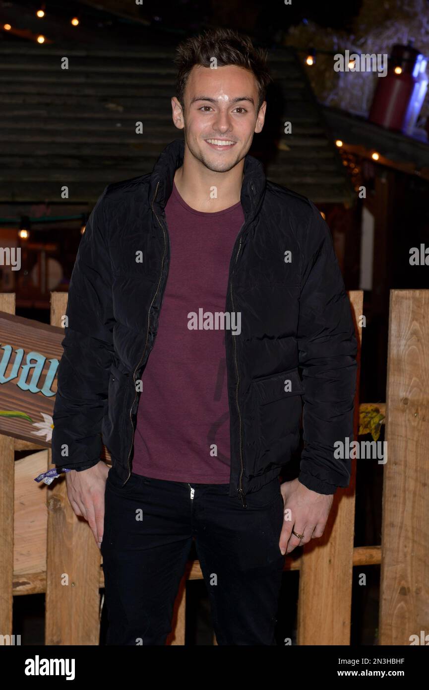 Tom Daley poses for photographers at the opening of the Winder ...