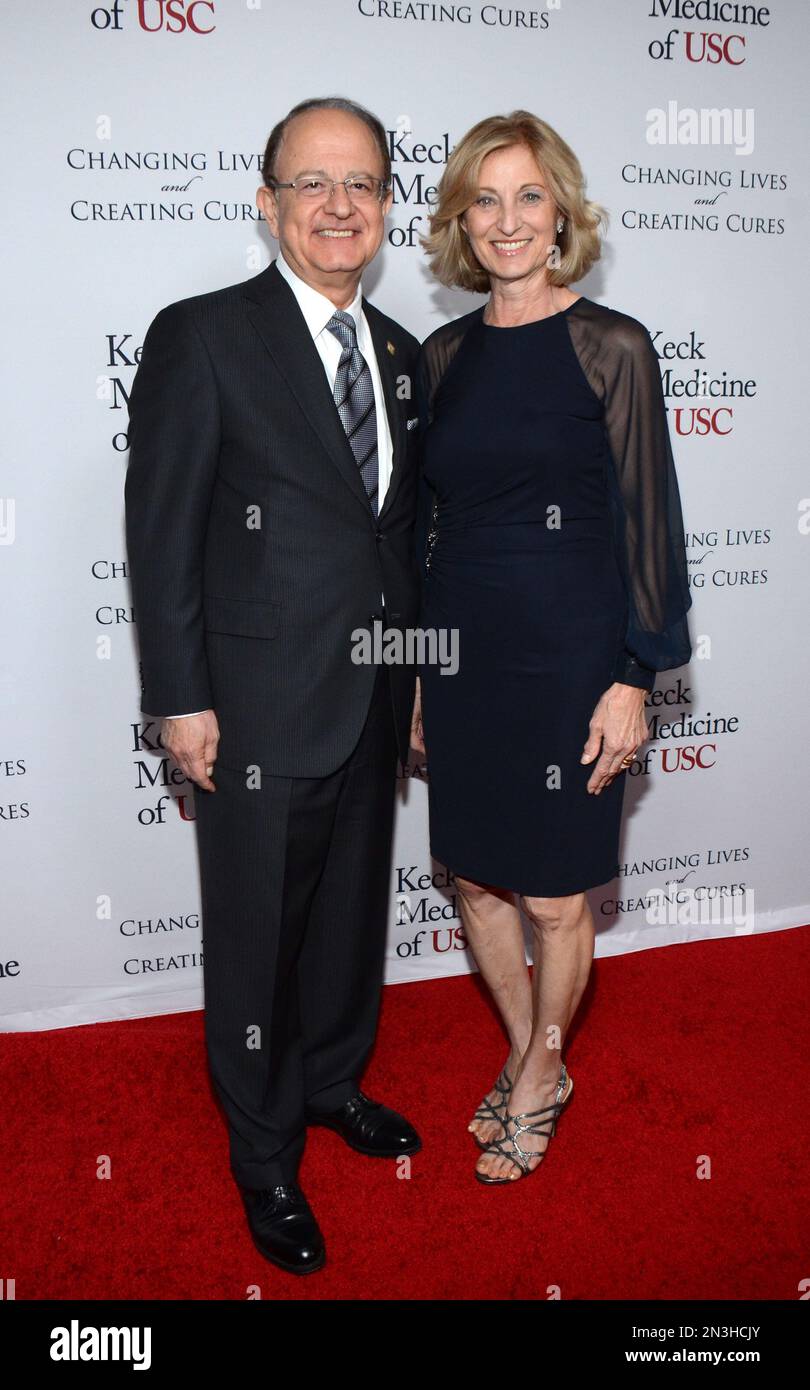 C.L. Nikias, President, USC and wife Niki Nikias arrive at Changing ...