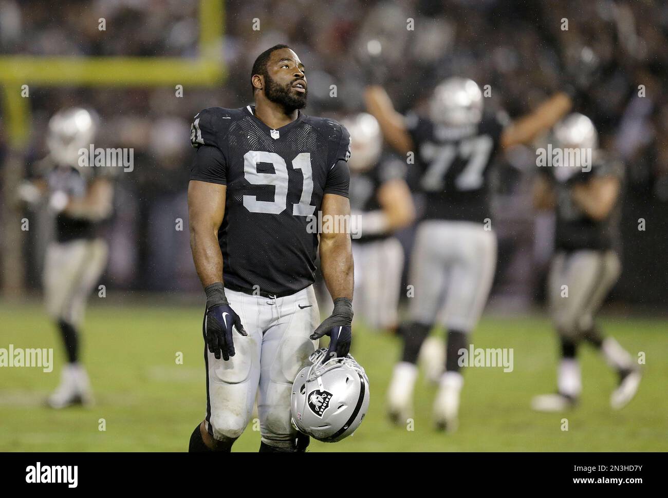 Oakland Raiders defensive end Justin Tuck (91) walks off the field ...