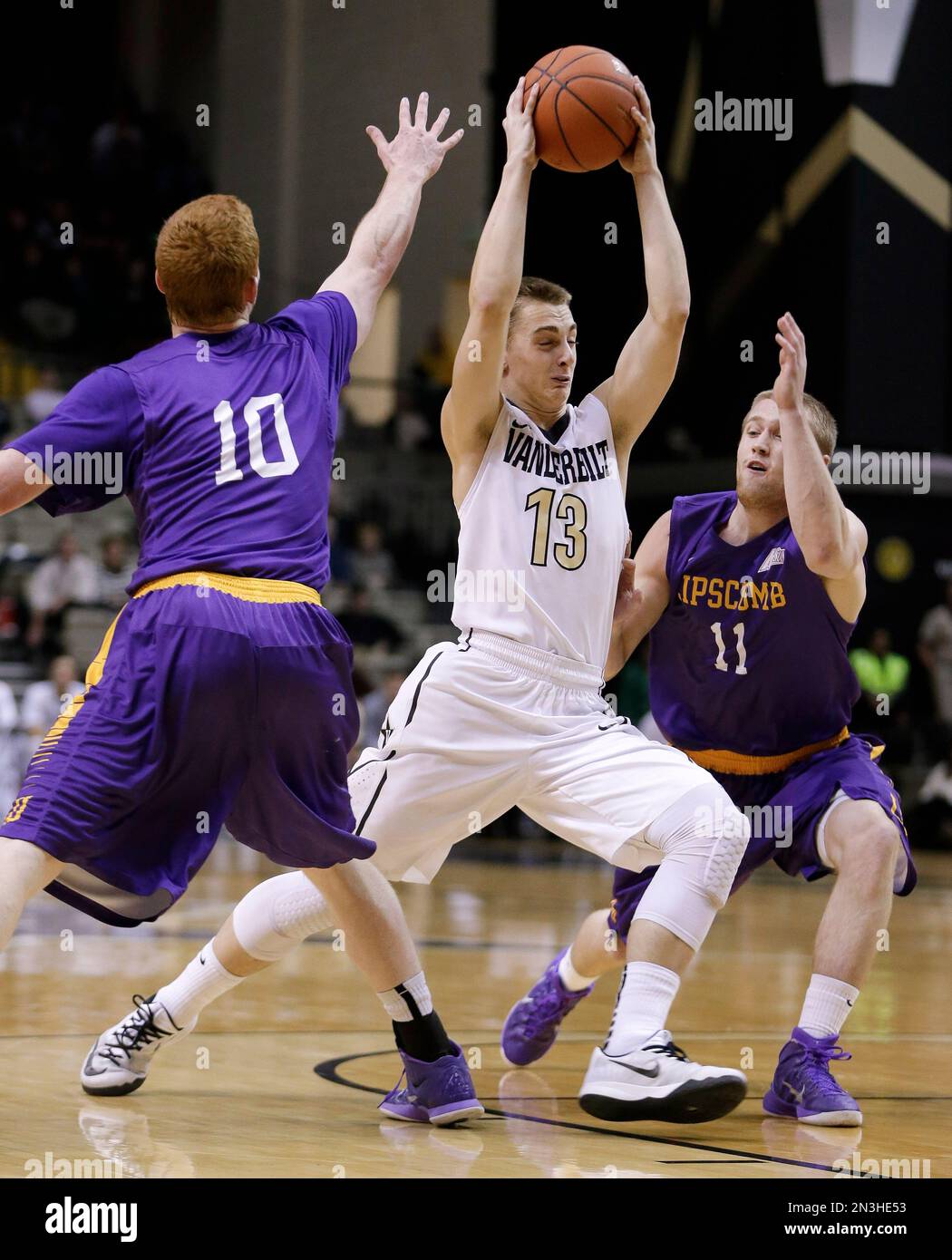 Vanderbilt guard Riley LaChance (13) drives between Lipscomb's Talbott ...