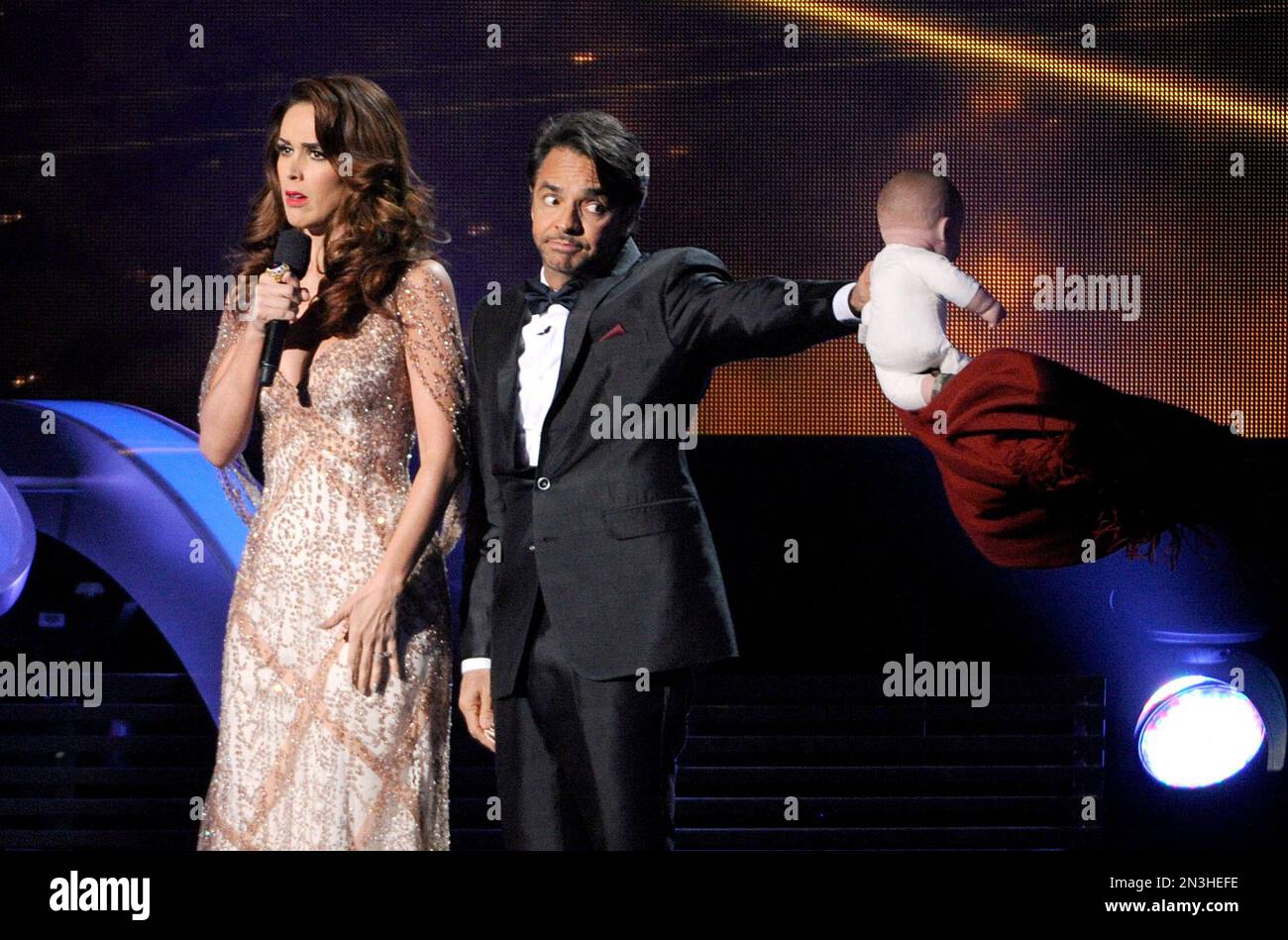 Hosts Jacqueline Bracamontes, left, and Eugenio Derbez speak on stage ...