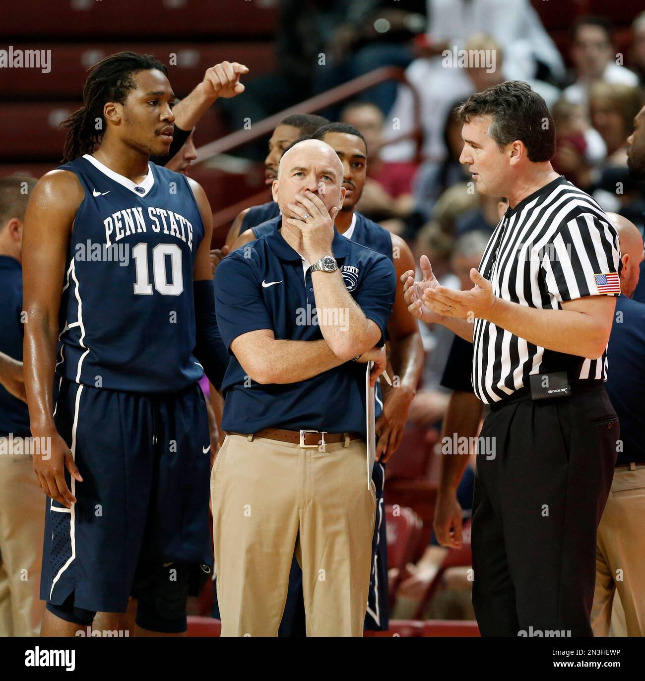 Penn State's head coach Patrick Chambers, center, listens with player ...