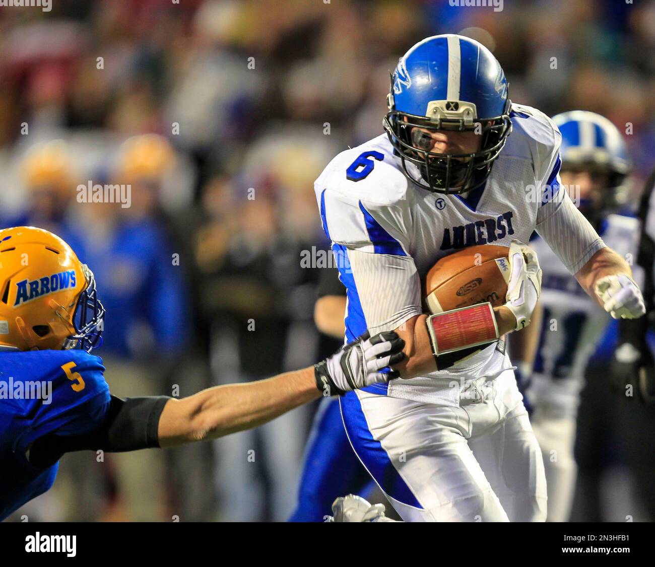 Amherst's Connor Zblewski (6) runs past Lancaster's Abe Thompson during ...