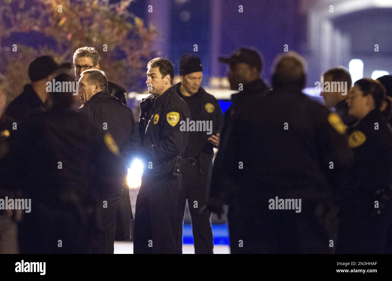 Tallahassee police chief Michael Deleo, center, talks with his officers ...