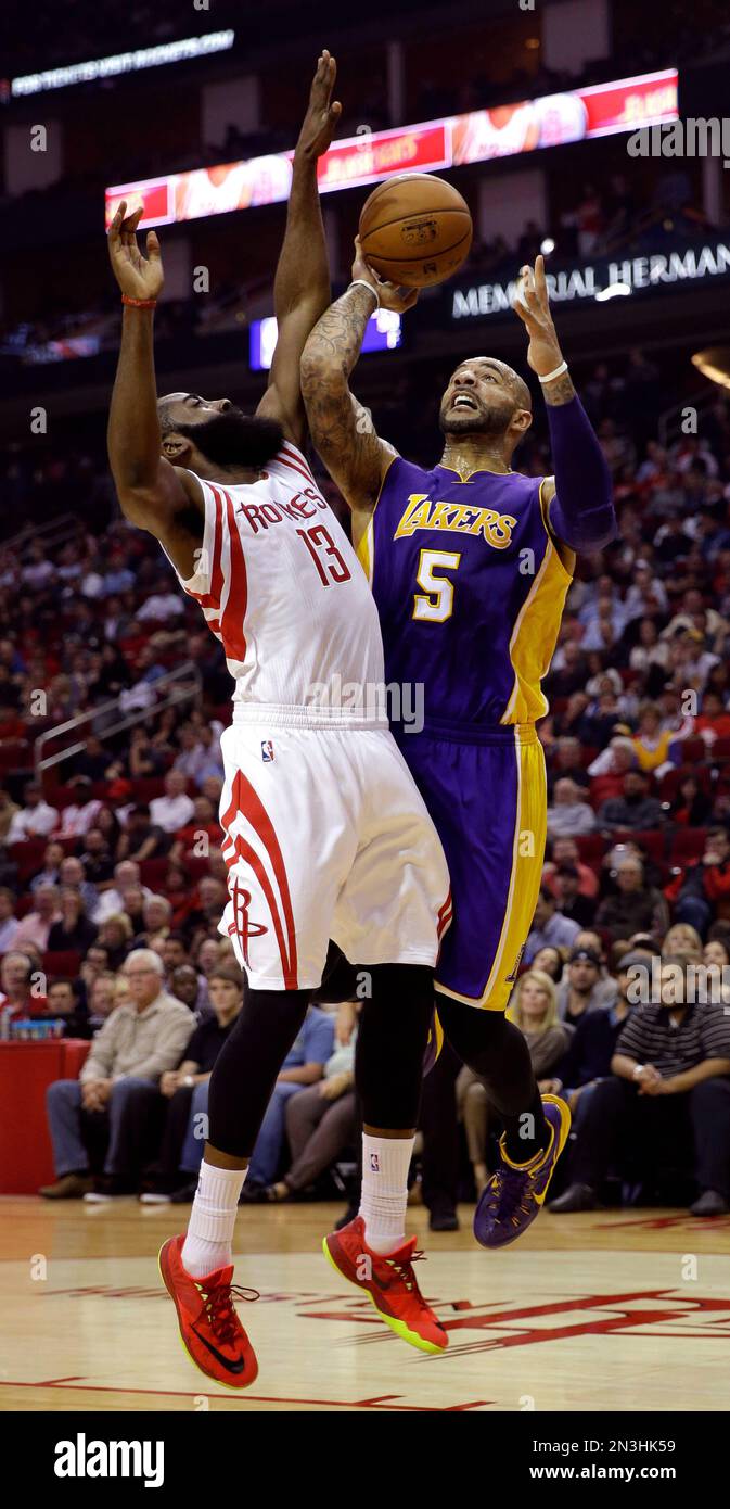 Los Angeles Lakers' Carlos Boozer (5) shoots as Houston Rockets' James ...