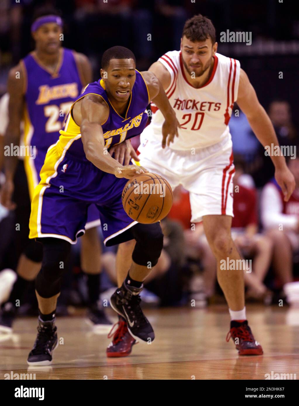 Los Angeles Lakers' Wesley Johnson (11) is fouled by Houston Rockets ...