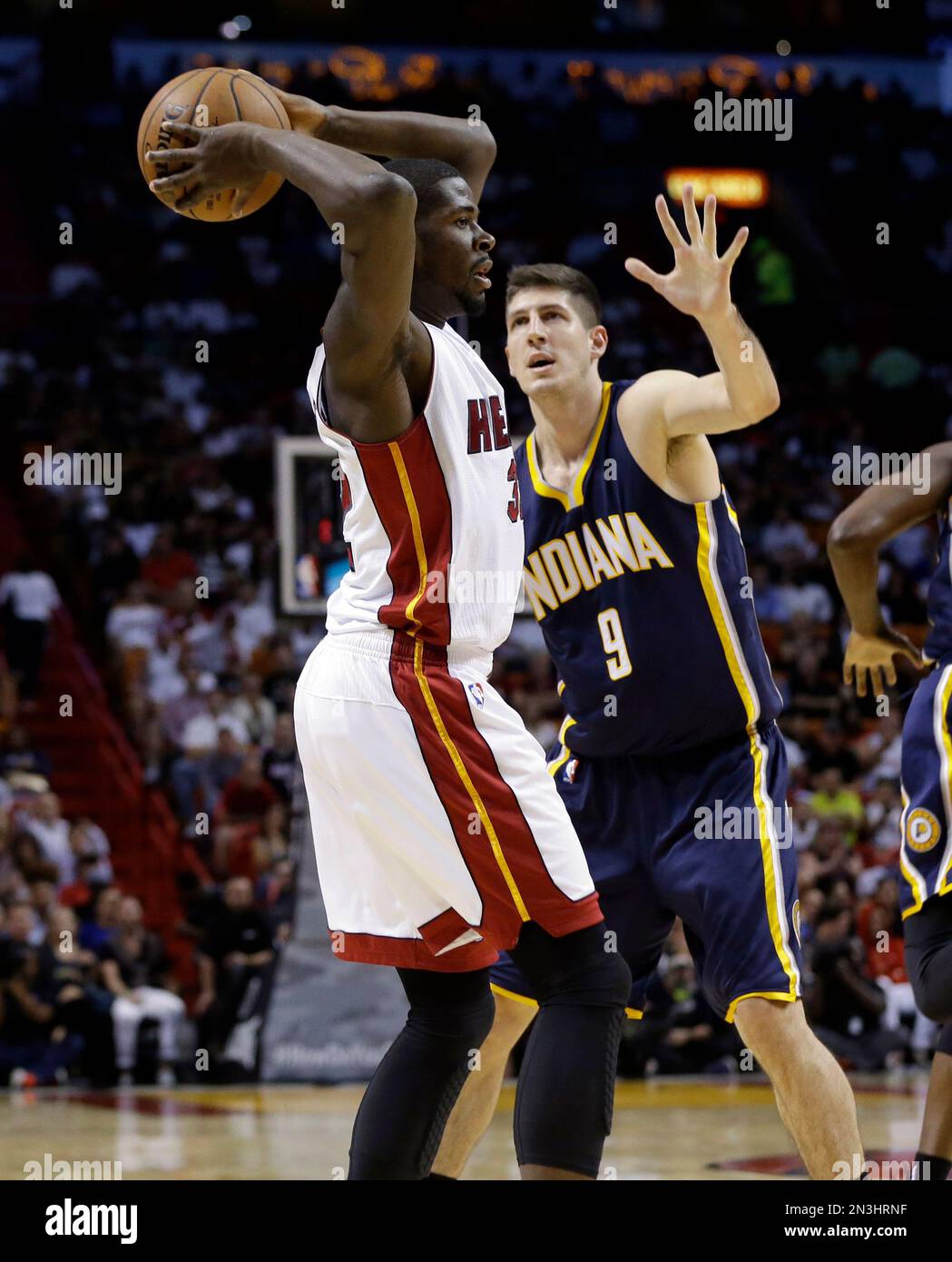 Miami Heat forward James Ennis, left, looks to pass as Indiana Pacers ...
