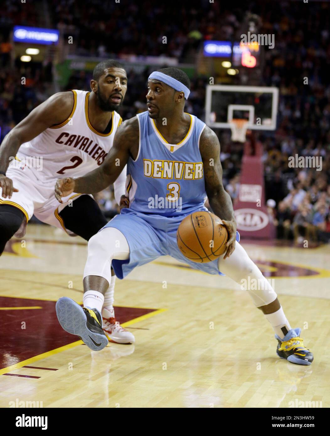 Denver Nuggets' Ty Lawson (3) drives against Cleveland Cavaliers' Kyrie ...