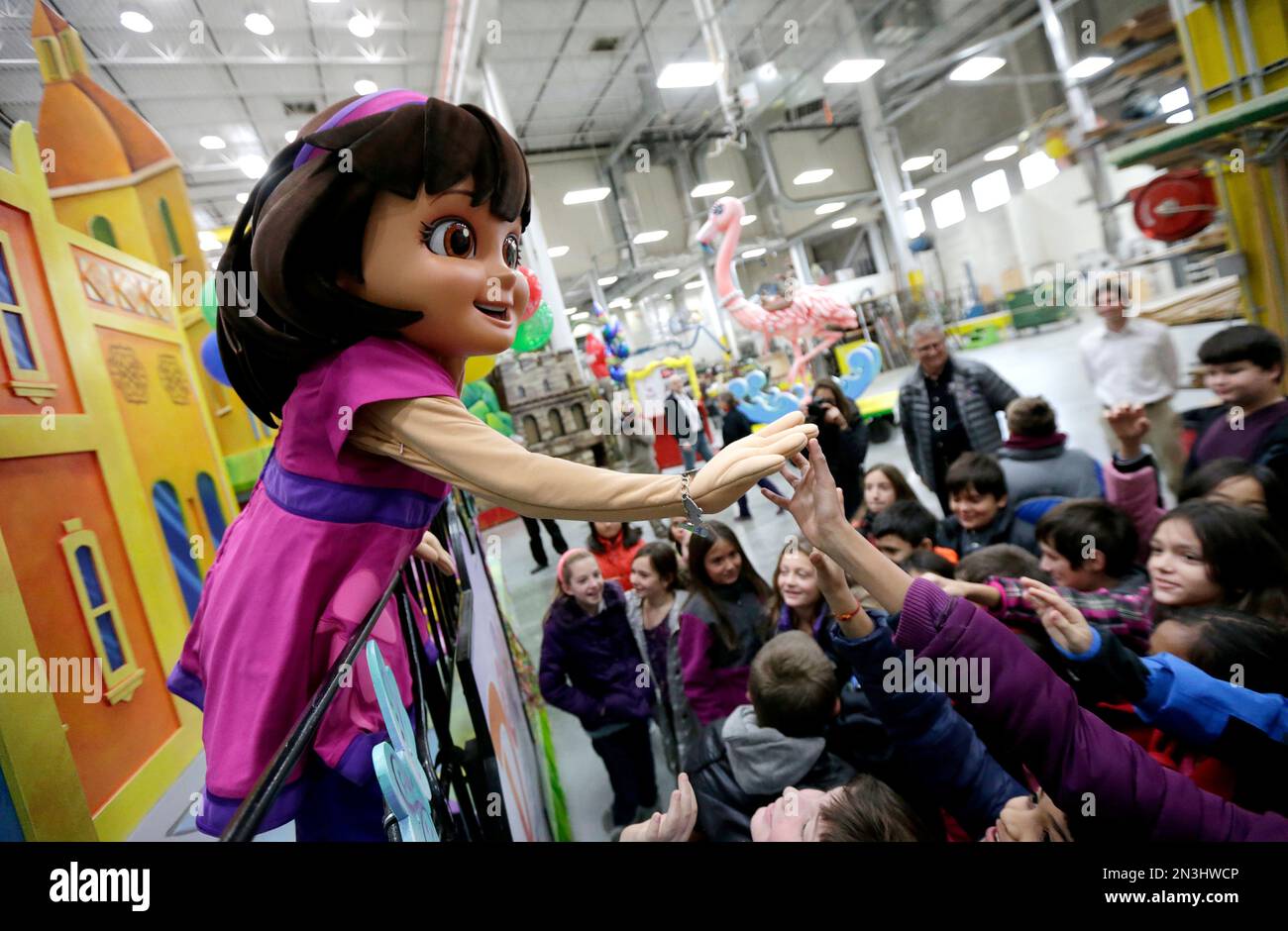 A person dressed in the costume of the cartoon character Dora the ...