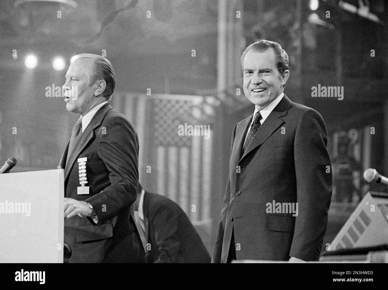President Richard Nixon smiles as Vice President Gerald Ford speaks to ...