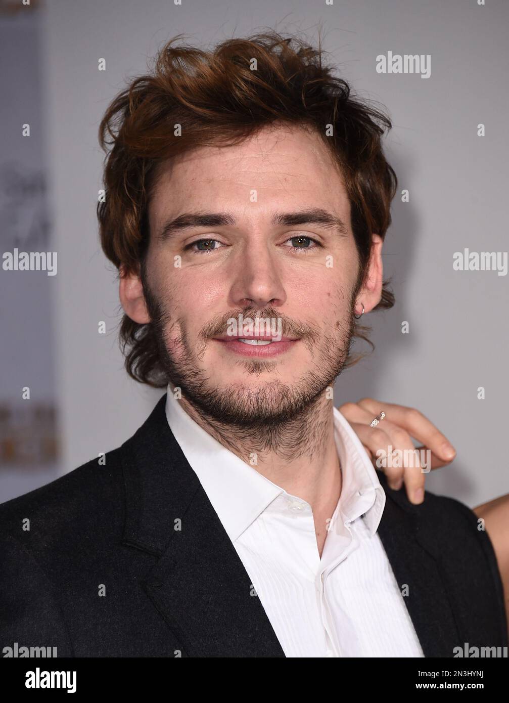 Sam Claflin arrives at the Los Angeles premiere of "The Hunger Games ...
