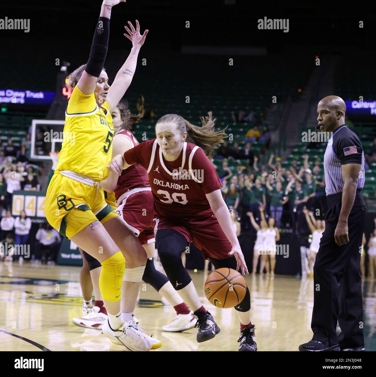 Oklahoma guard Taylor Robertson (30) drives on Baylor forward Caitlin ...
