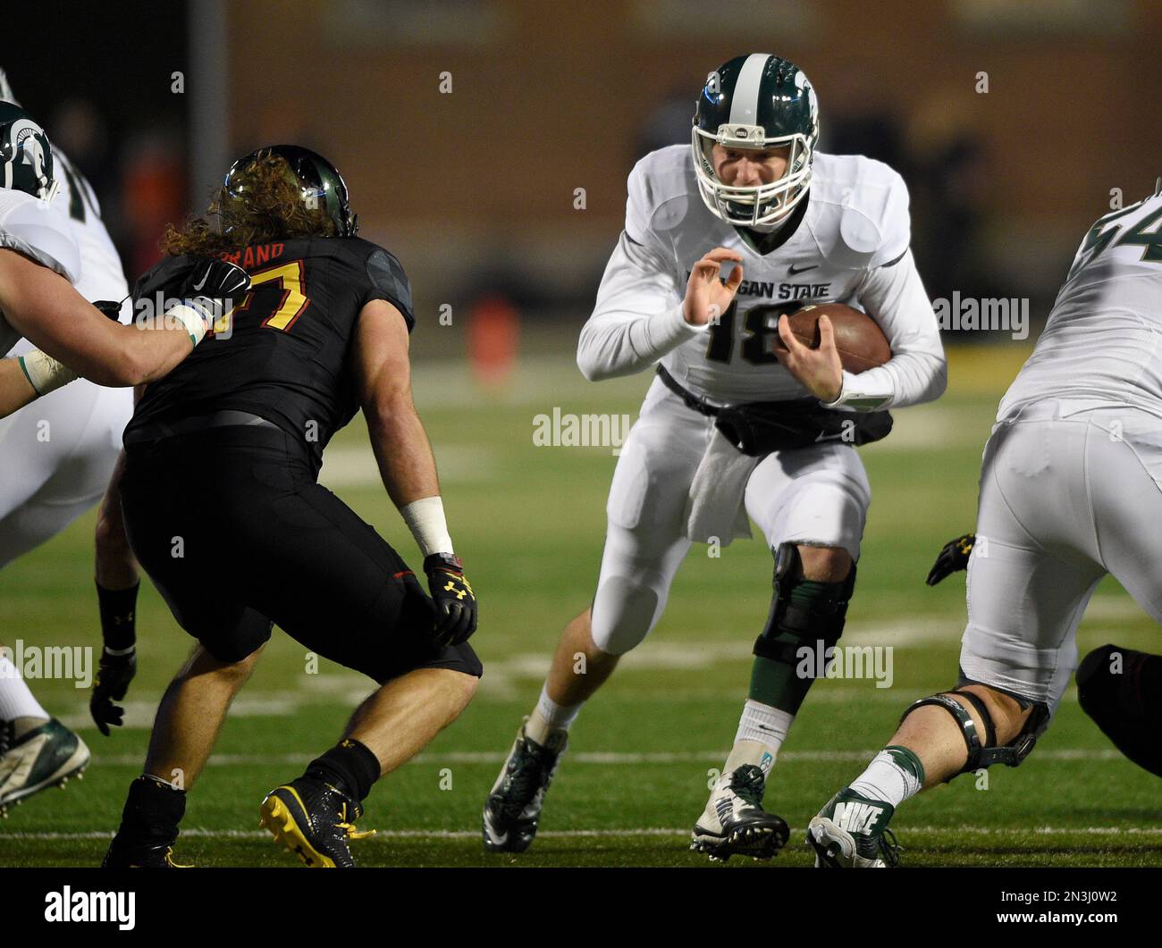 Michigan State quarterback Connor Cook (18) runs with the ball against ...