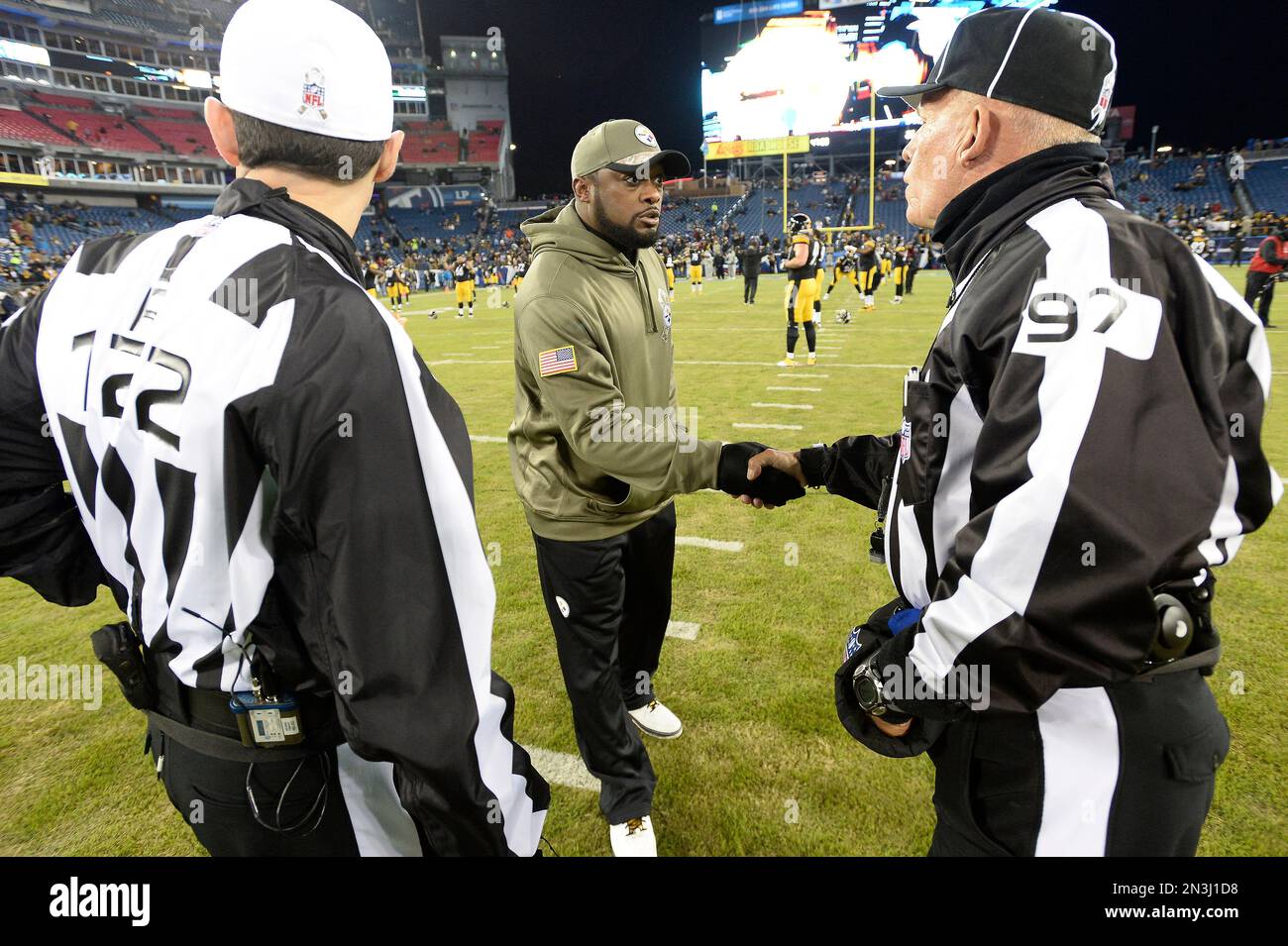 Pittsburgh Steelers head coach Mike Tomlin greets referee Brad Allen ...