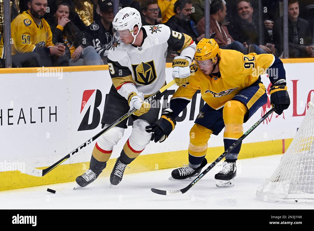 Vegas Golden Knights center Jack Eichel (9) moves the puck ahead of Nashville Predators center ...