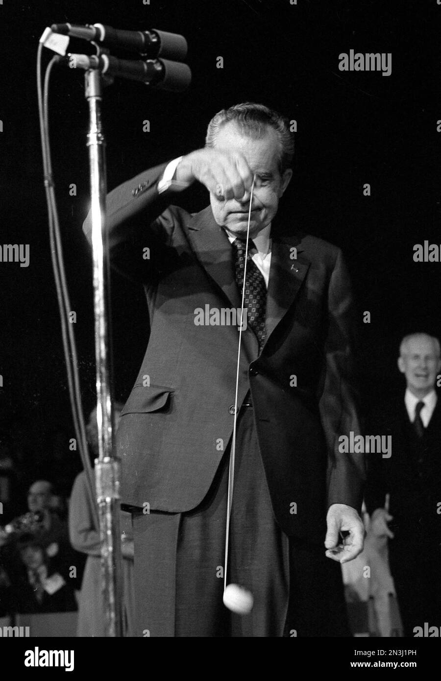 President Nixon has trouble working a yo-yo which was given to him by ...