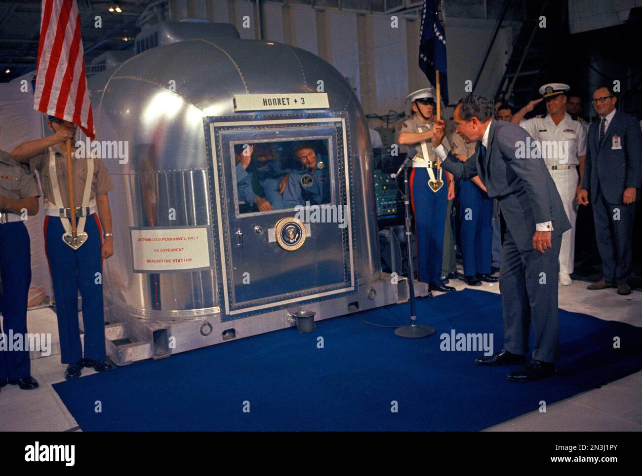 President Nixon gives the "OK" sign to the Apollo 11 astronauts ...