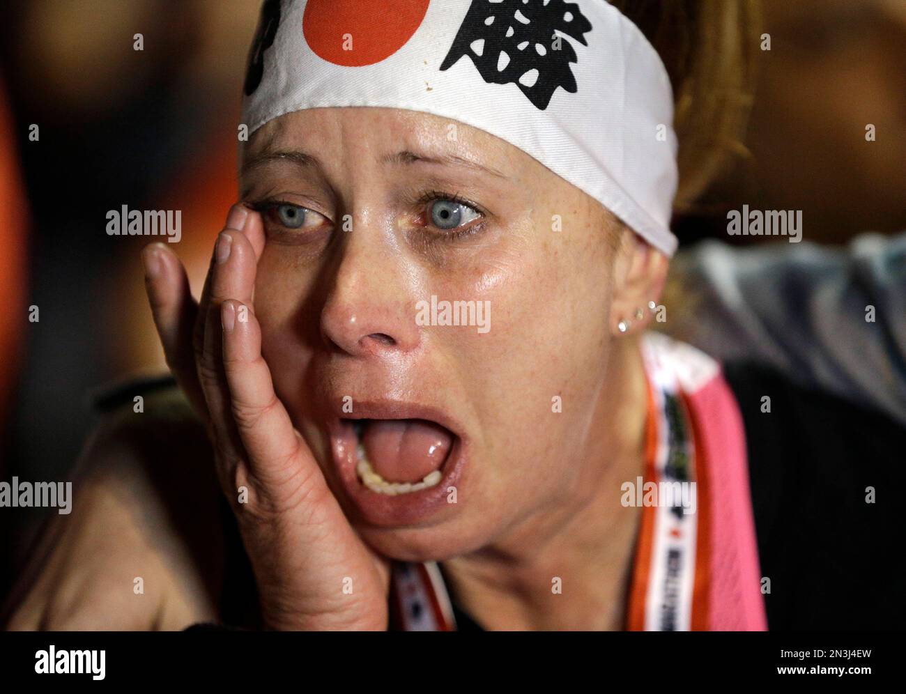 Patty Coaley wipes a tear from her eye after finishing the half ...