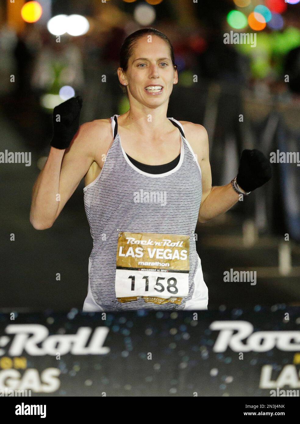 Cathy Cullen nears the finish line to be the first female finisher at ...