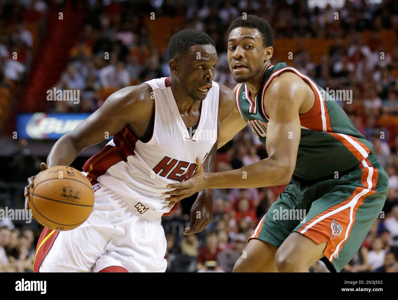 Miami Heat forward Luol Deng, of Sudan, right, drives past Milwaukee ...