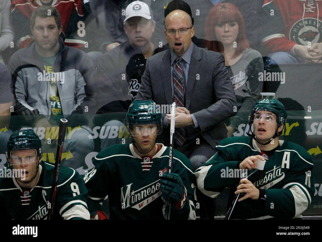 Minnesota Wild head coach Mike Yeo calls out to his players during the ...
