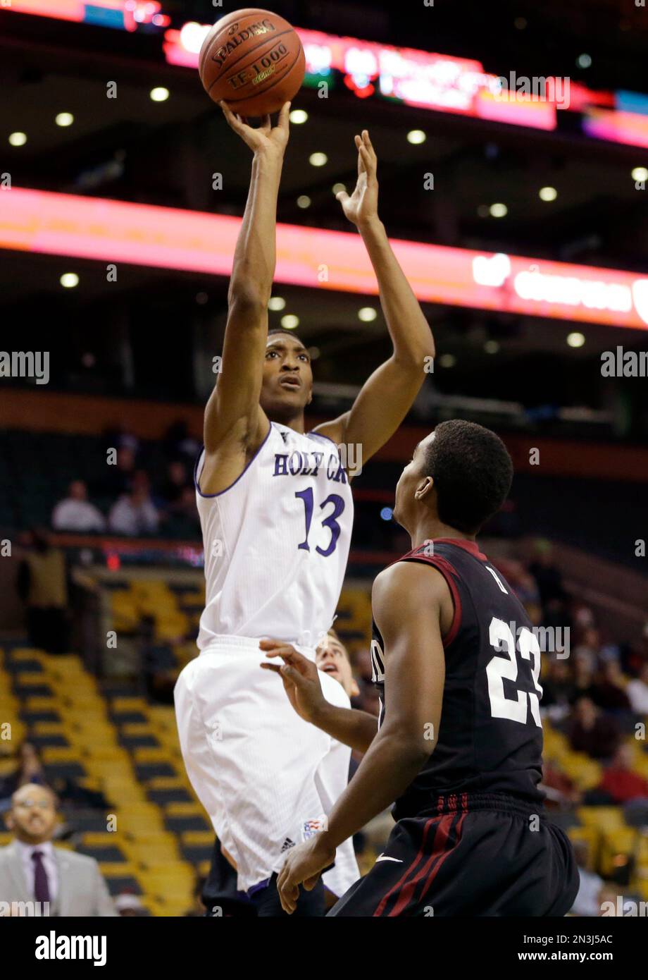 Holy Cross forward Malcolm Miller (13) shoots at the basket over ...