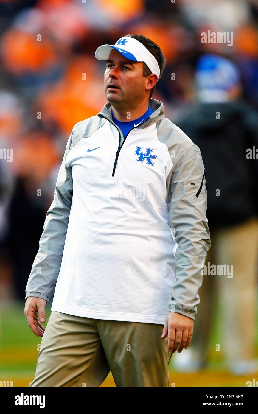 Kentucky head coach Mark Stoops watches his team warm up before an NCAA ...