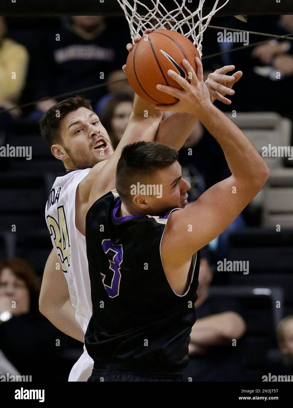 Trevecca Nazarene's Matt Gamberoni (3) grabs a rebound in front of ...