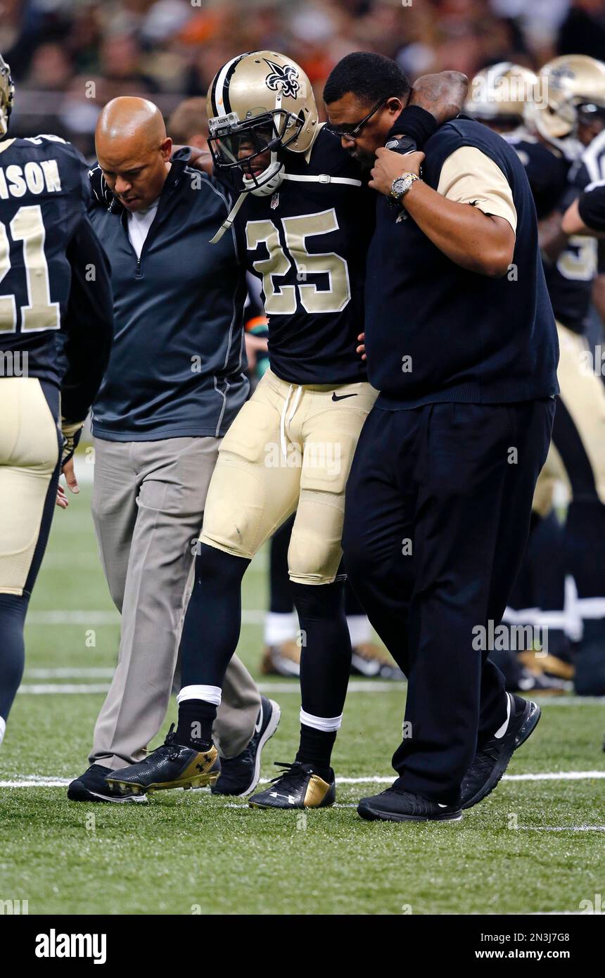 New Orleans Saints free safety Rafael Bush (25) is helped off the field ...