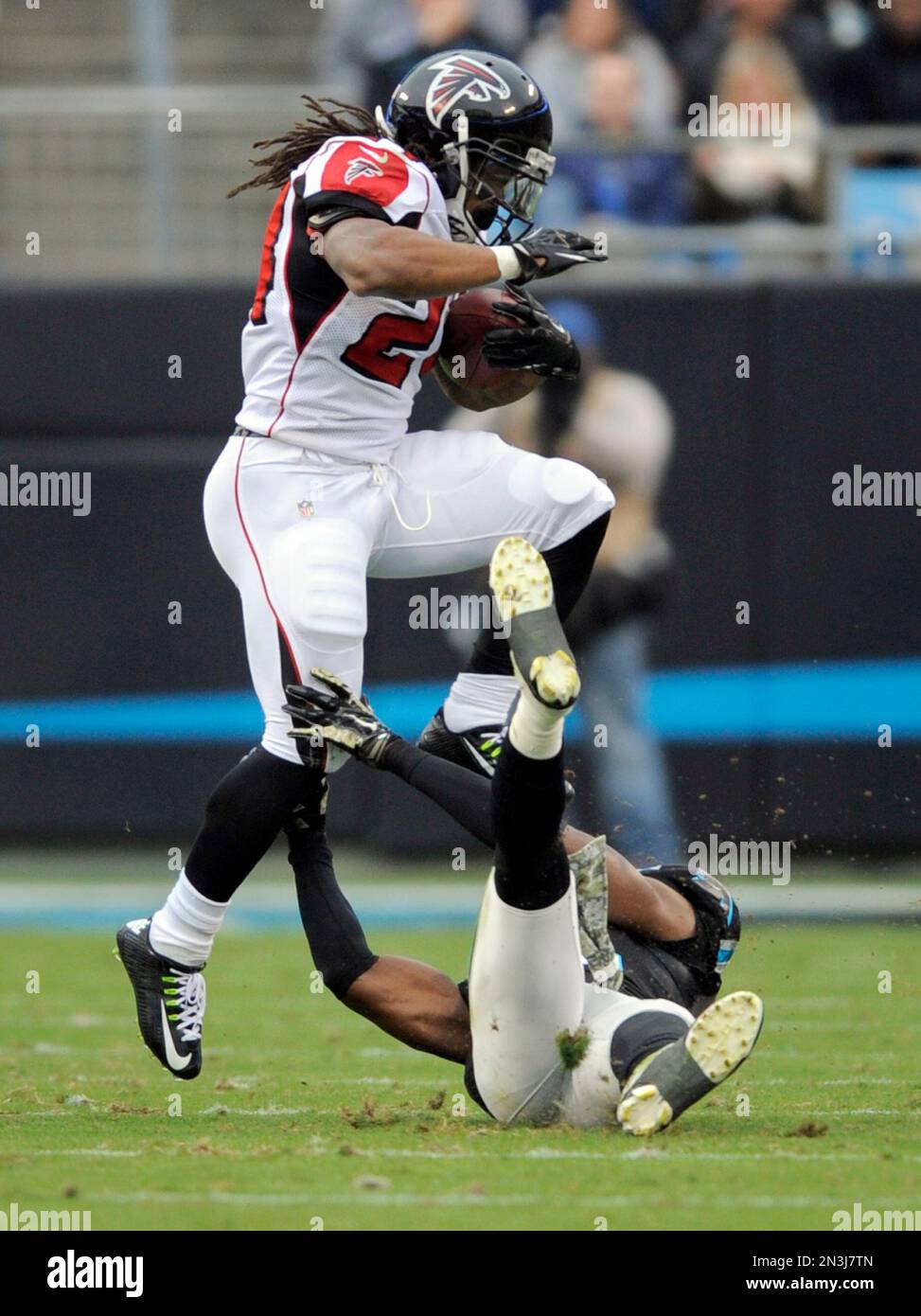 Atlanta Falcons' Devonta Freeman, top, hurdles Carolina Panthers' Roman ...