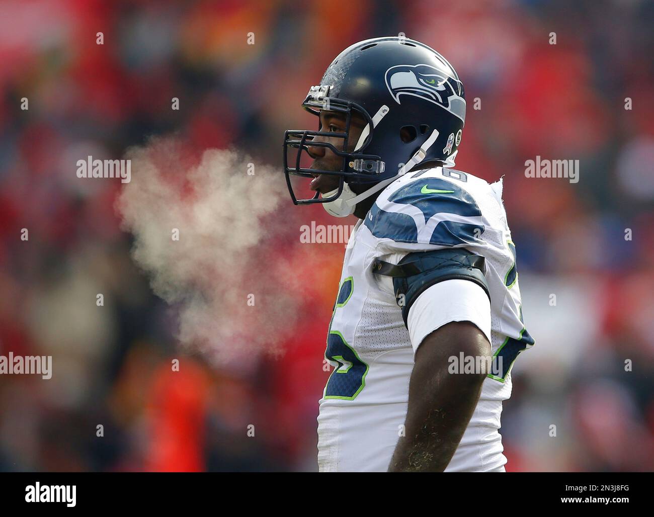 Seattle Seahawks tackle Russell Okung (76) exhales in freezing weather ...