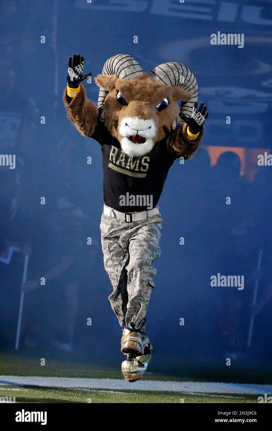St. Louis Rams mascot Rampage runs on the field before the start of an ...