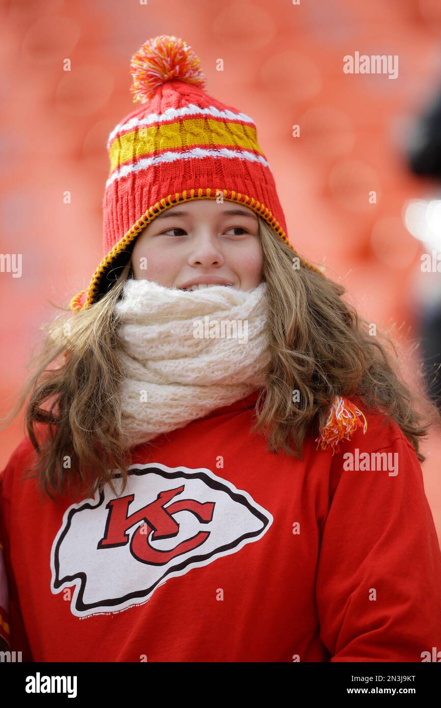 A Kansas City Chiefs fan is bundled against the cold in the stands ...
