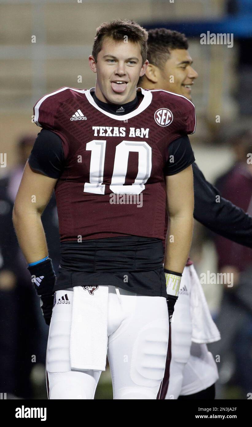 Texas A&M quarterback Kyle Allen (10) sticks his tongue out before an ...