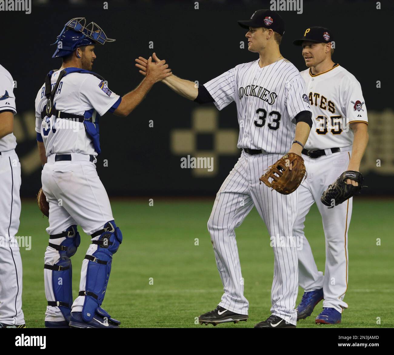 MLB All-Stars catcher Drew Butera, left, celebrates with Justin Morneau ...