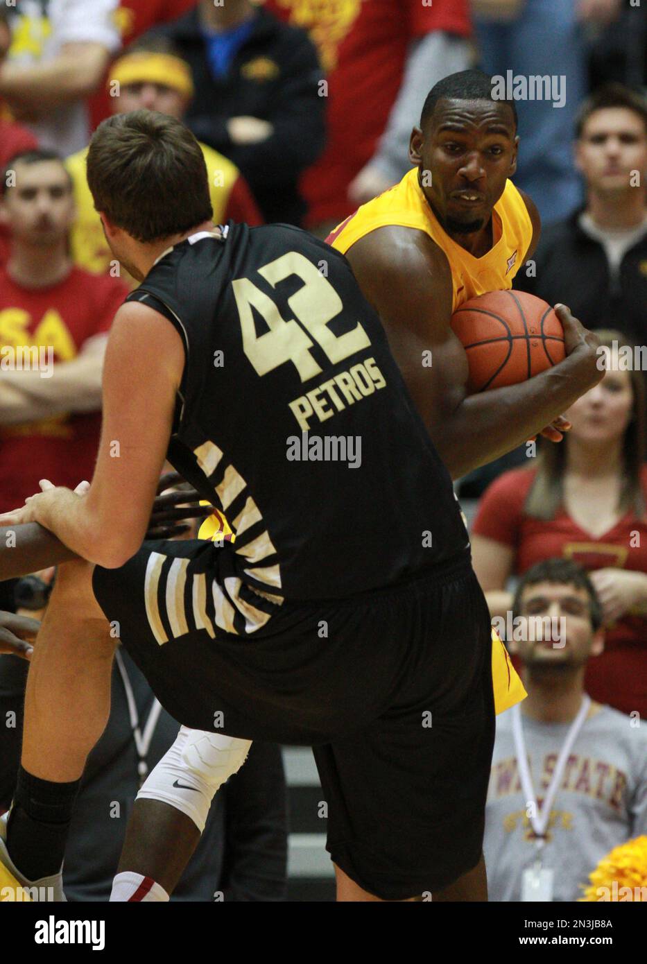 Iowa State forward Dustin Hogue, right, grabs a rebound away from ...