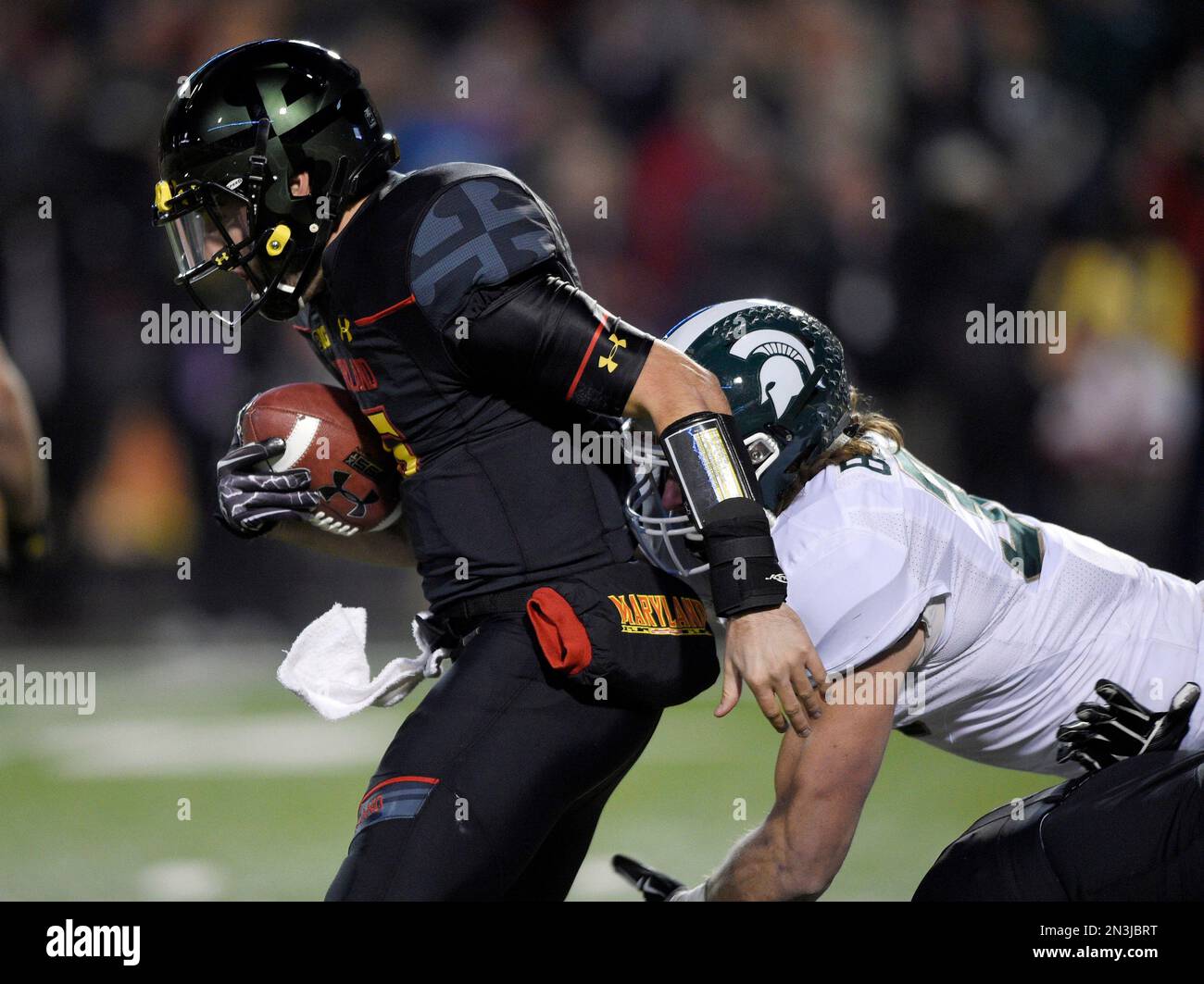 Michigan State linebacker Riley Bullough, right, pursues Maryland ...