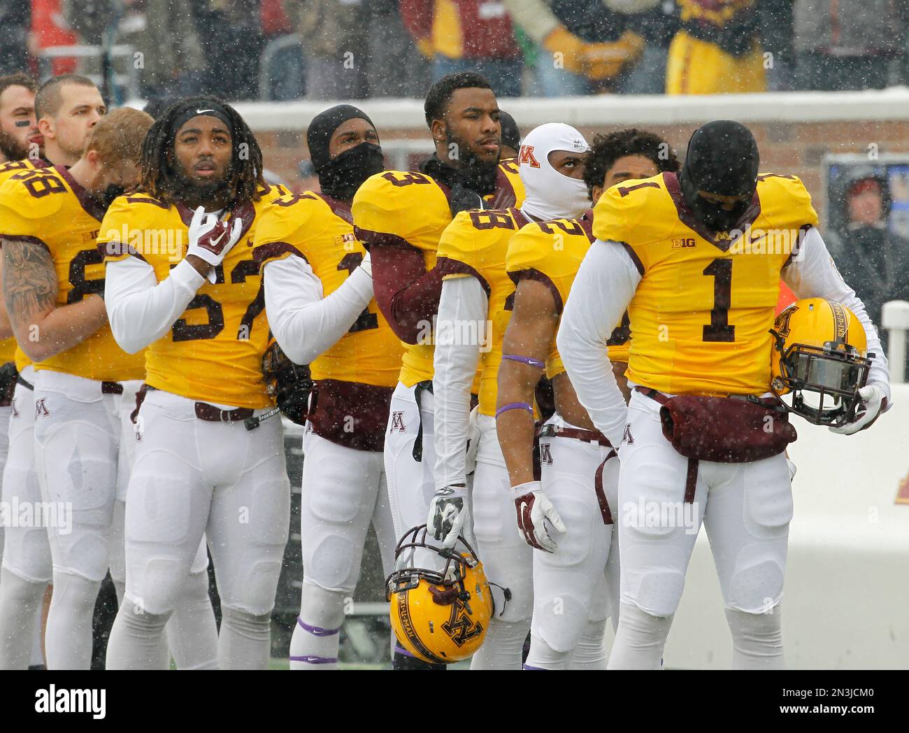 Minnesota wide receiver KJ Maye (1) and teammates stand during the ...