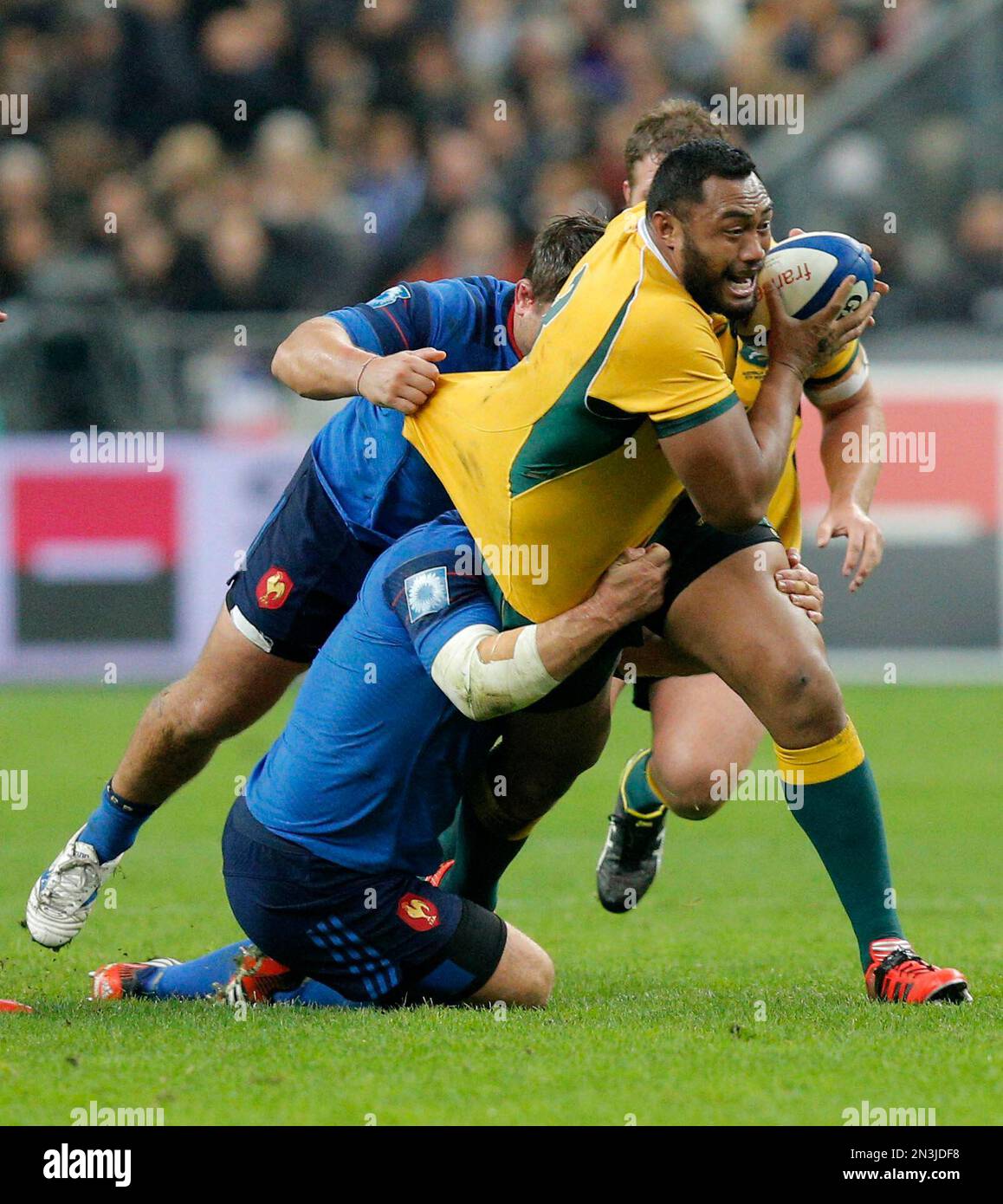 Australian player Sekope Kepu is grabbed by French players, during the ...