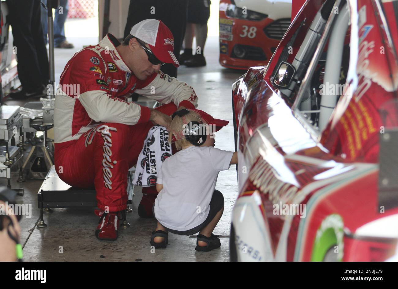 Kevin Harvick and his son, Keelan, sit in his garage, Saturday, Nov. 15 ...