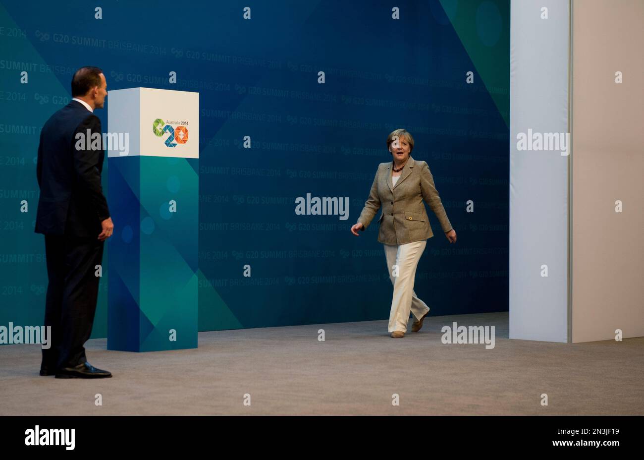 Germany's Chancellor Angela Merkel, right, is welcomed by Australia's ...