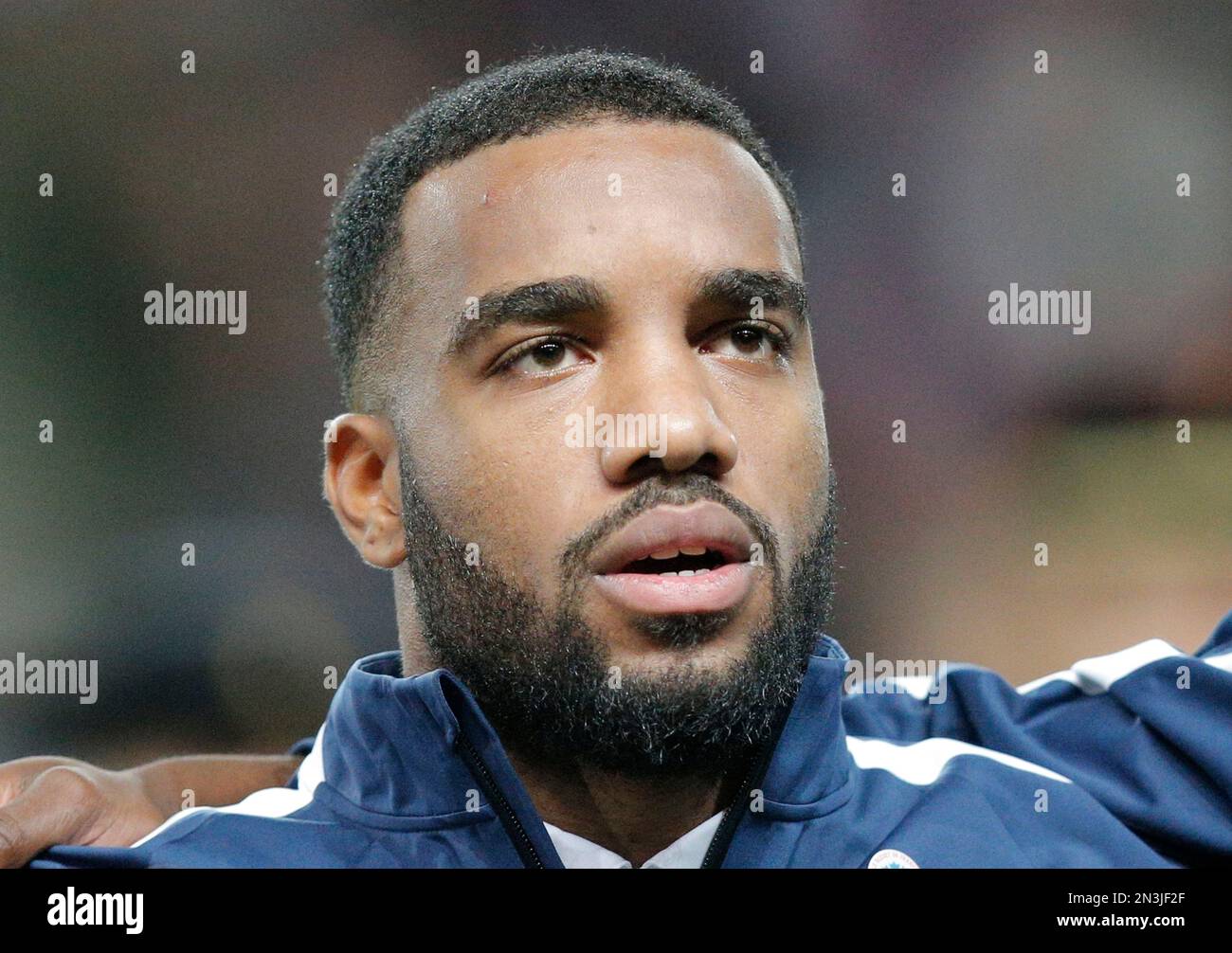 France's Alexandre Lacazette, stands at attention during the French ...