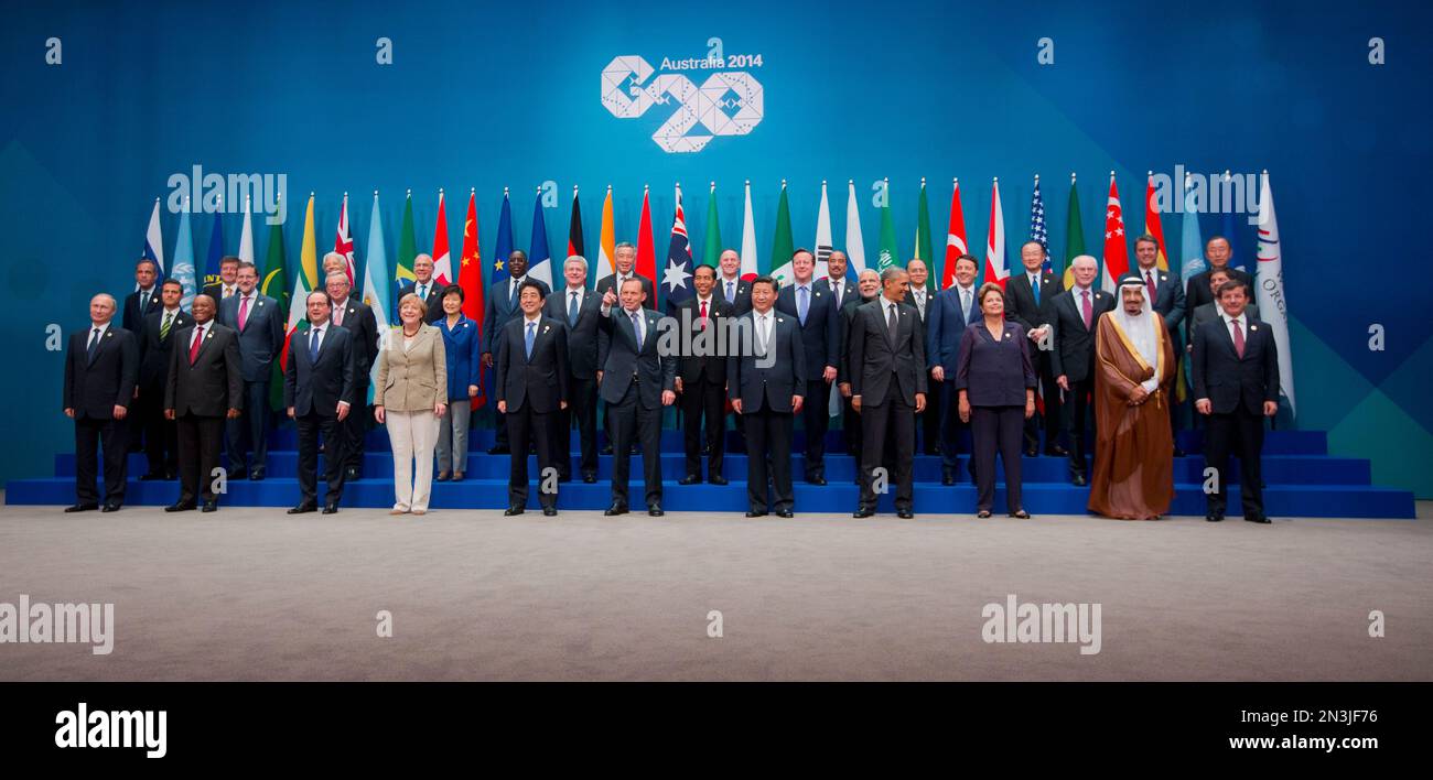 Prime Minister of Australia Tony Abbott, center, points to ...
