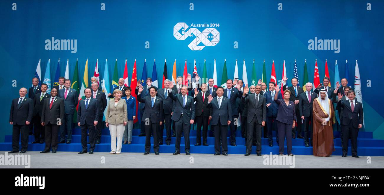 Leaders pose for a group photo at the G20 summit in Brisbane, Australia ...