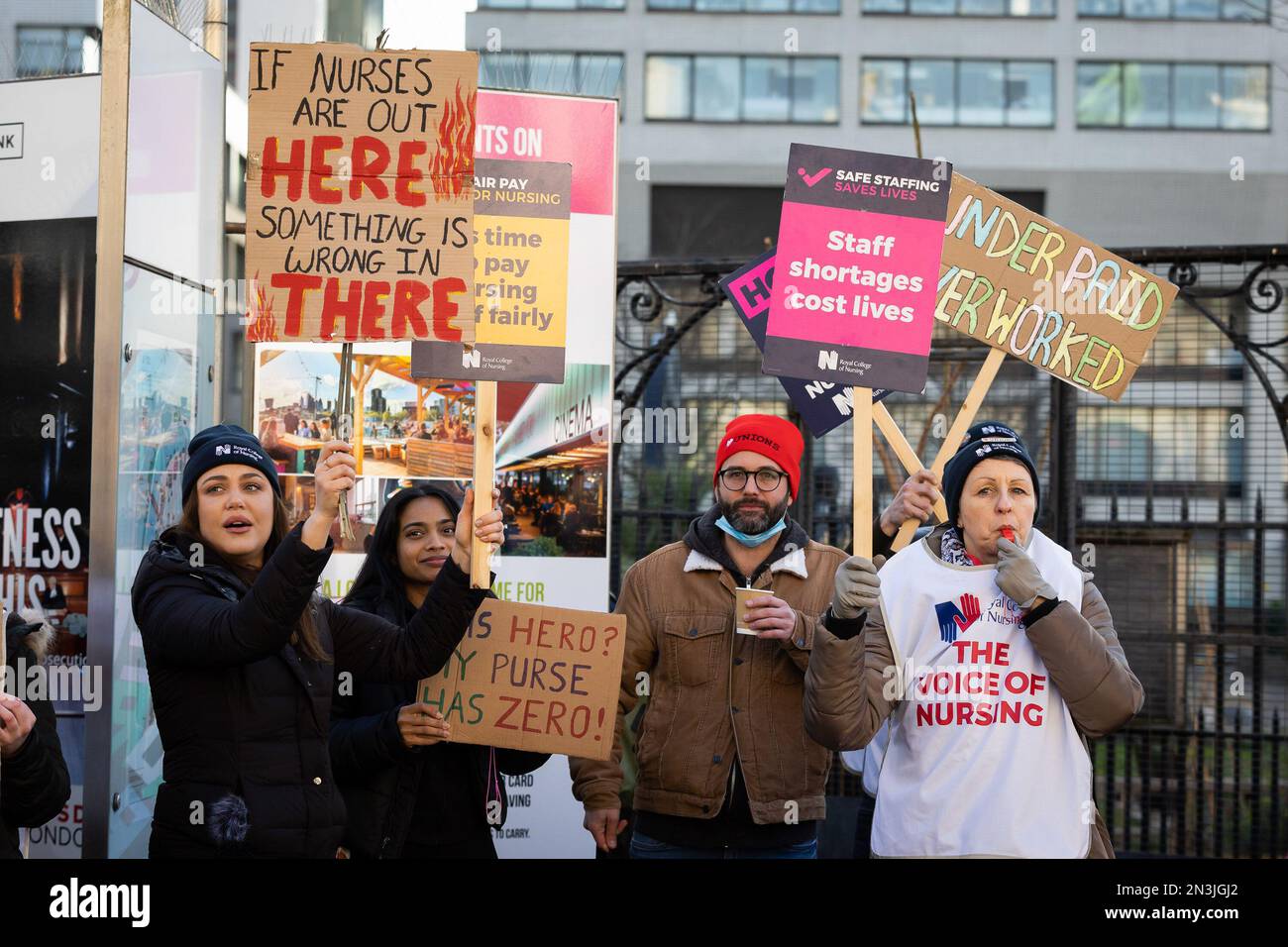 London, UK. 07th Feb, 2023. Nurses hold up placards expressing their ...