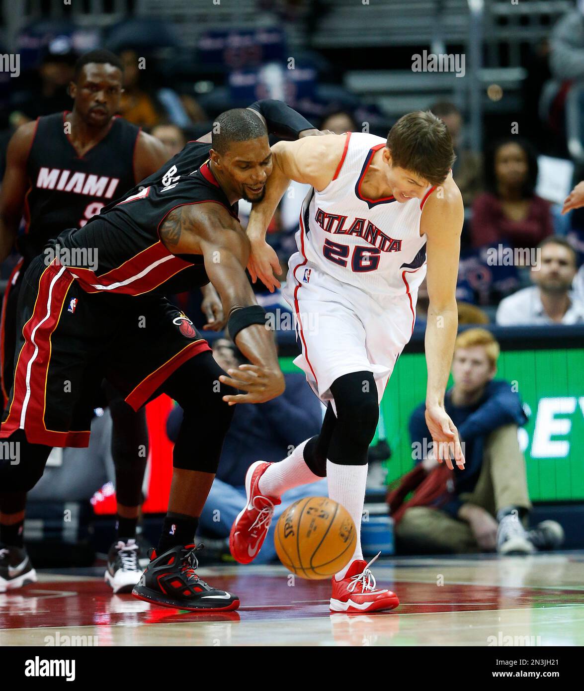 Miami Heat center Chris Bosh (1) and Atlanta Hawks guard Kyle Korver ...