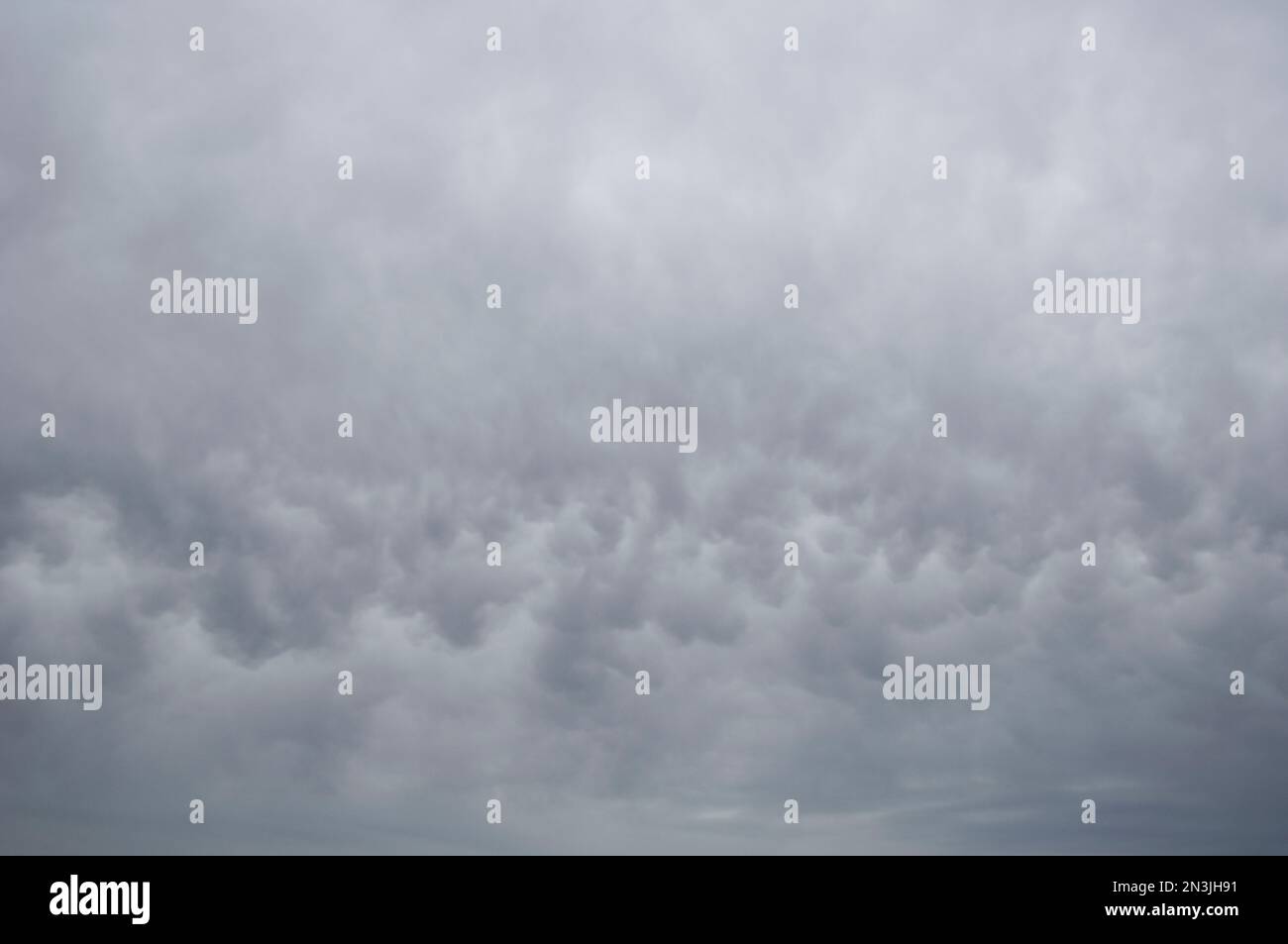 Grey storm clouds fill a sky after a rainstorm; Bismarck, North Dakota ...