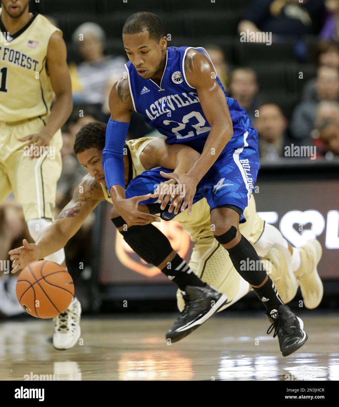 Wake Forest's Miles Overton, left, and North Carolina-Asheville's Corey ...