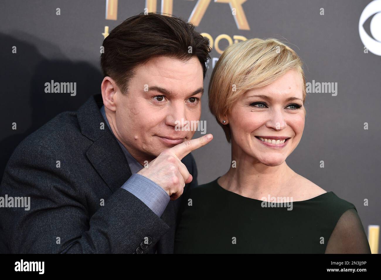 Mike Myers, left, and Kelly Tisdale arrive at the Hollywood Film Awards ...